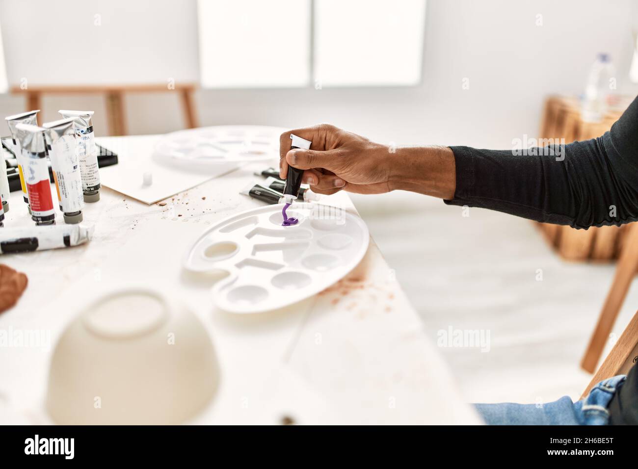 Hand of african american artist man painting at art studio Stock Photo ...