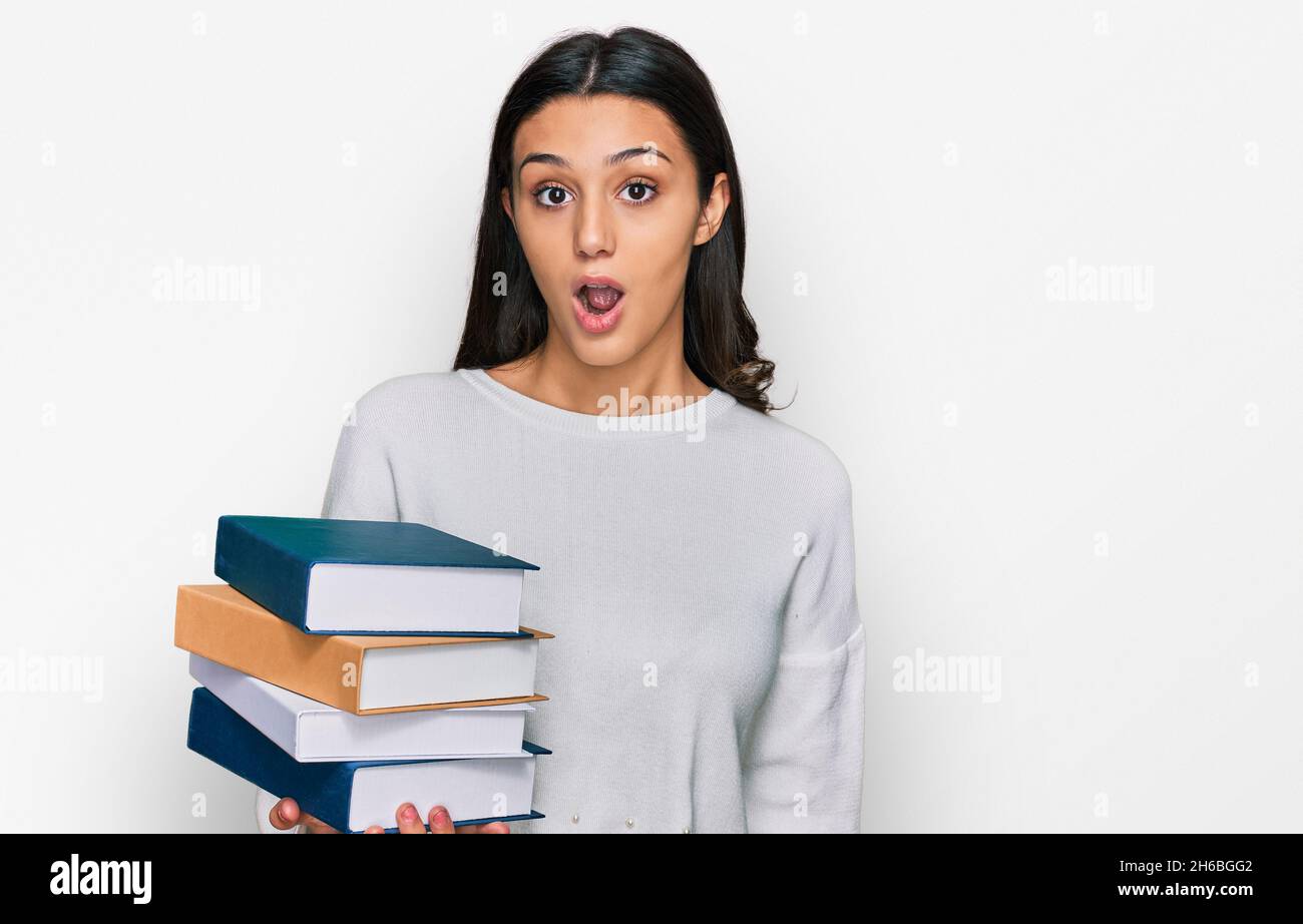 Student worried pile of books hi-res stock photography and images - Alamy