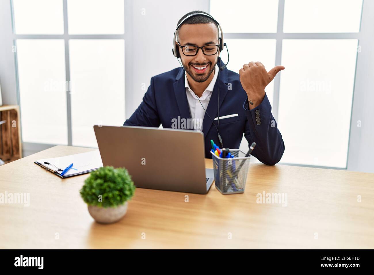 African american young man wearing call center agent headset at the ...
