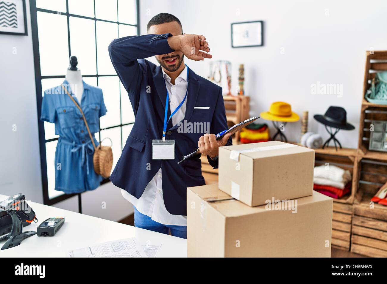 African american man working as manager at retail boutique smiling ...