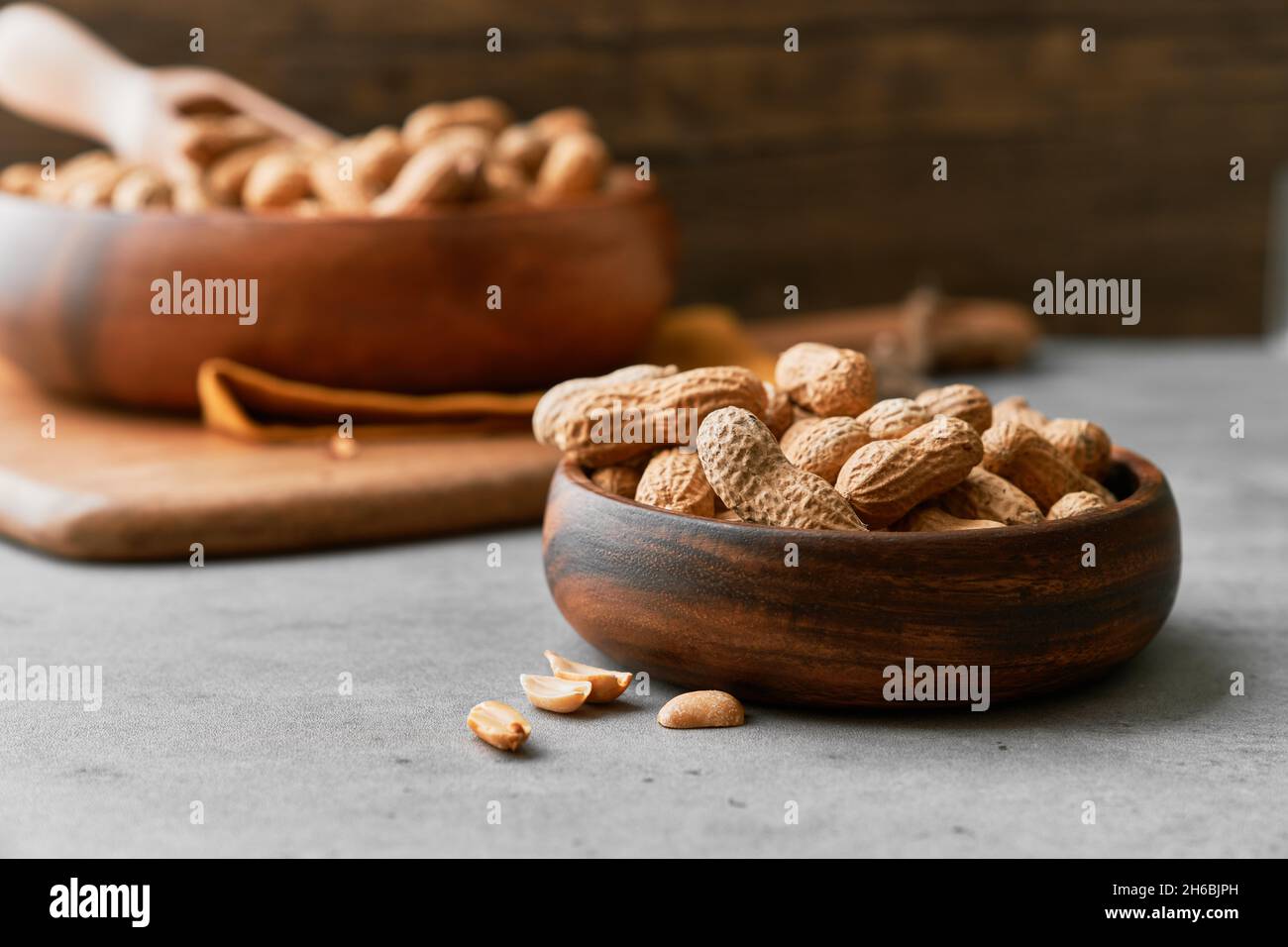 Image of bunch of peanuts in a bowl on a concrete surface Stock Photo ...