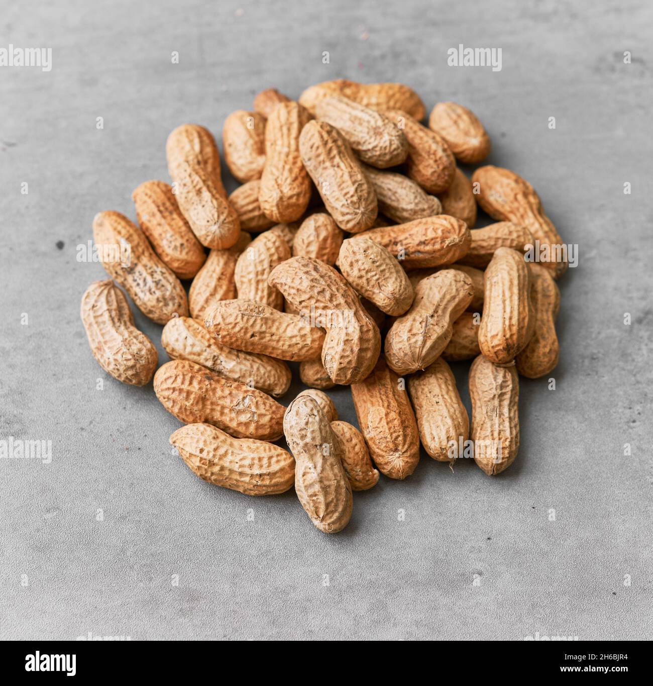 Image of bunch of peanuts on a concrete surface Stock Photo - Alamy