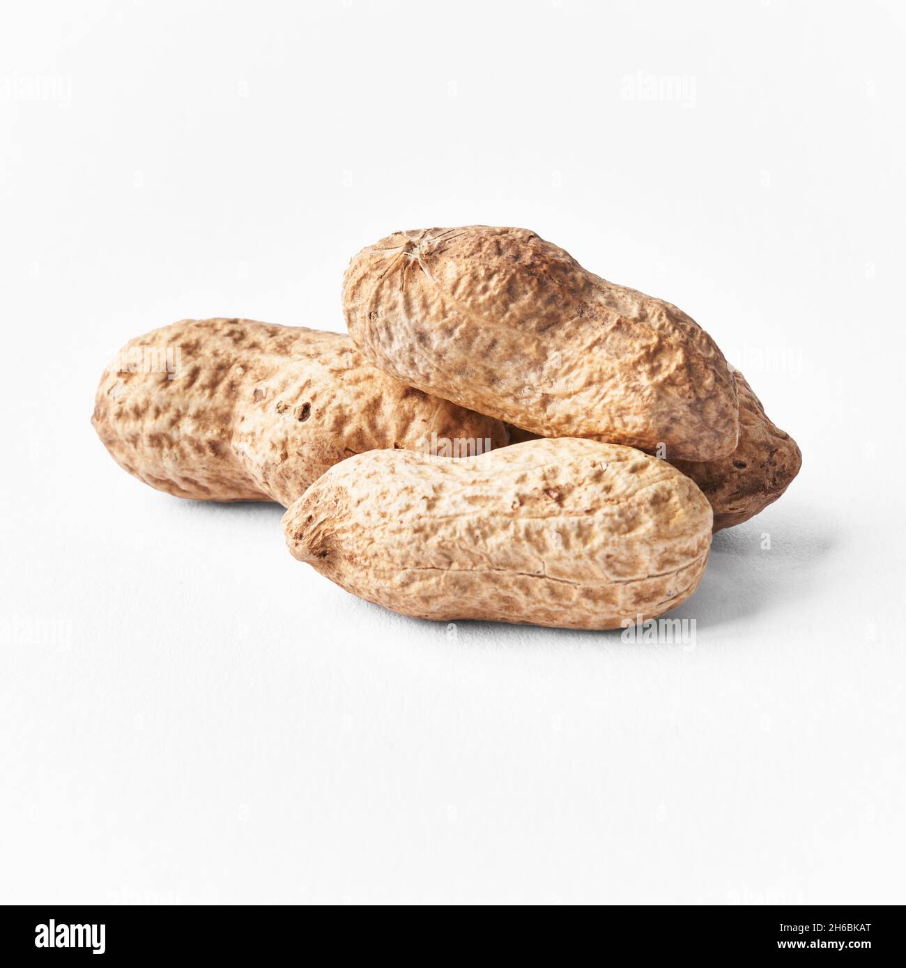 Bunch of peanuts with shell isolated on a white background Stock Photo ...