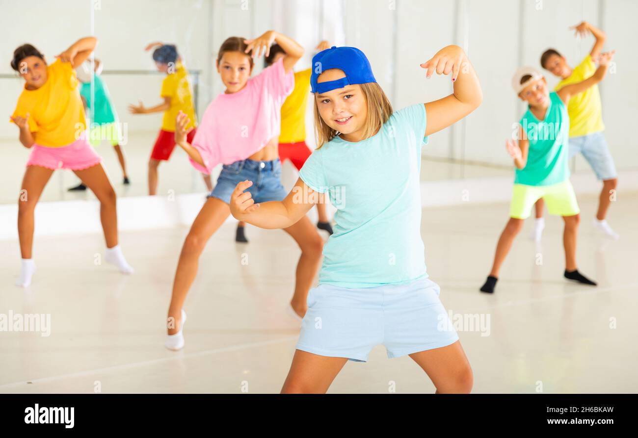 Tween girl breakdancer posing during group dance class Stock Photo - Alamy
