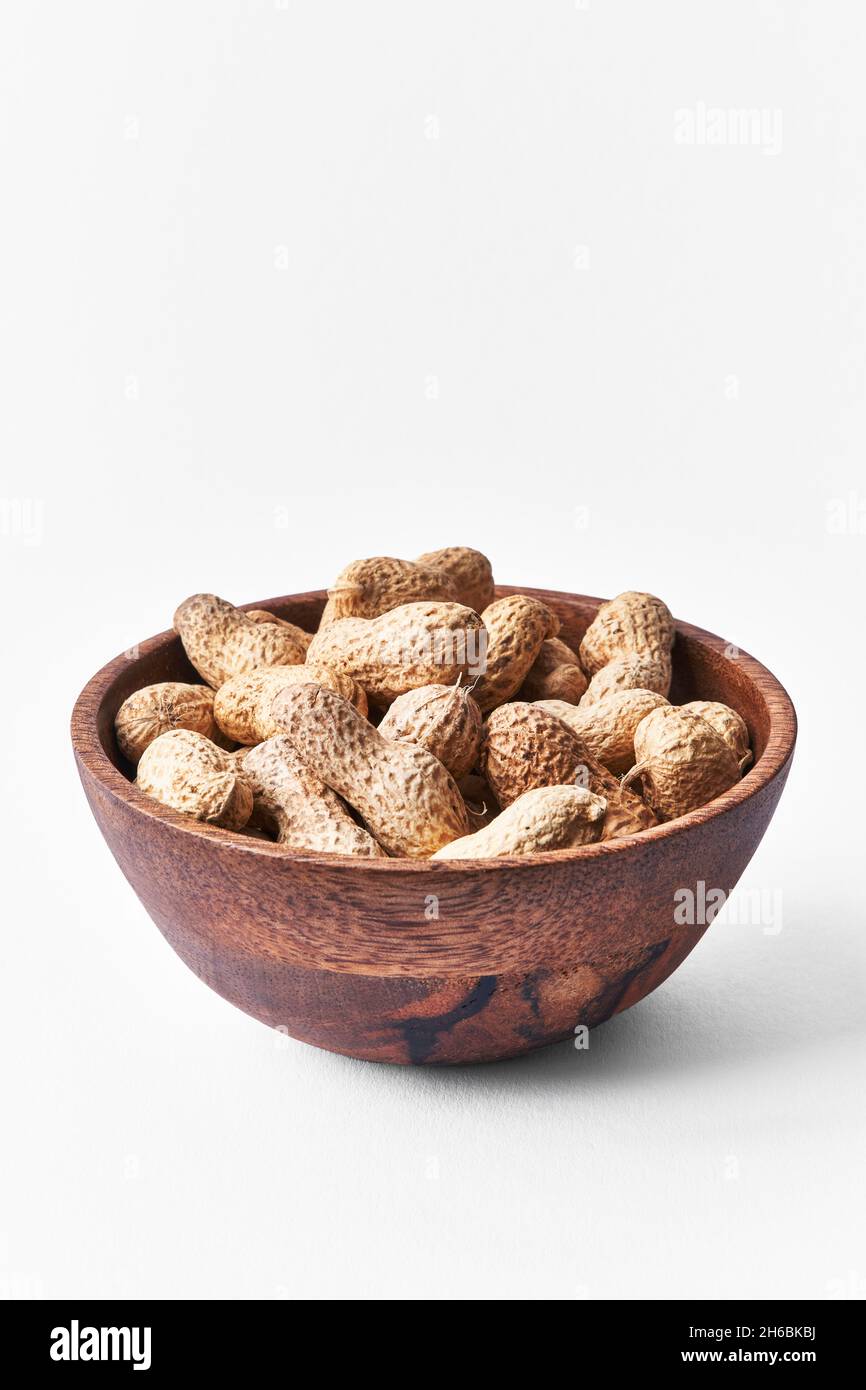 Bowl of peanuts with shell isolated on a white background Stock Photo ...