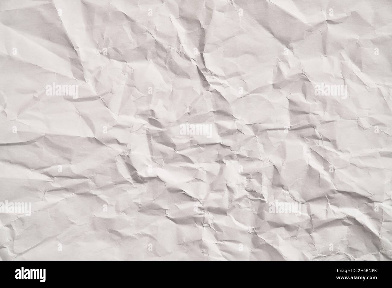 White crumpled paper texture with wrinkles. Damaged and torn sheet ...