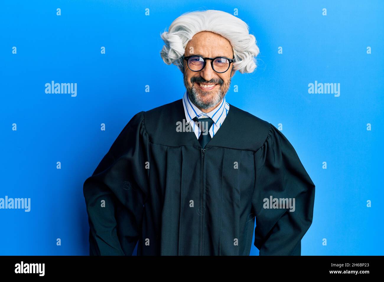 Middle age hispanic man wearing judge uniform with a happy and cool ...