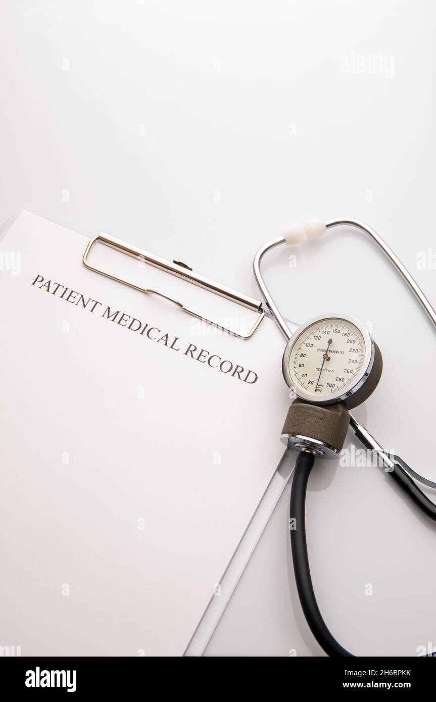 Patient medical record on clipboard with stethoscope. white copy space ...