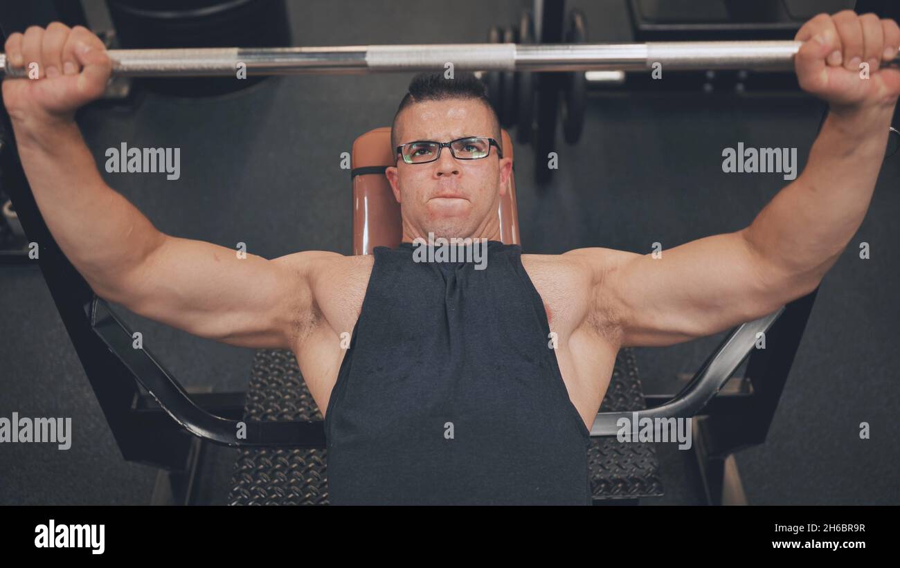 An Arab man pumps his chest in the gym Stock Photo - Alamy