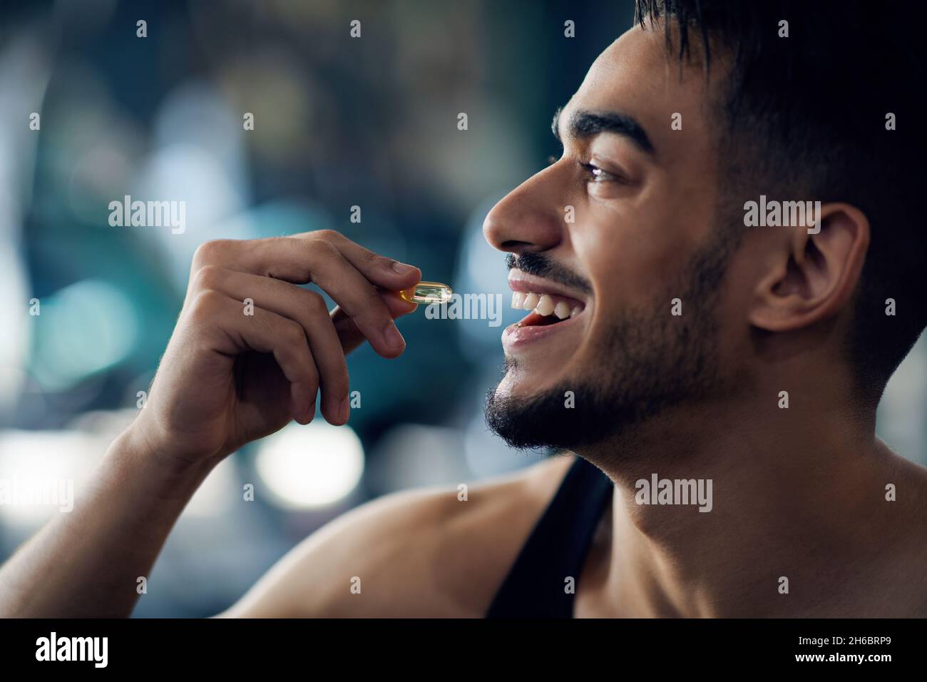Portrait Of Happy Sportive Arab Man Taking Supplement Capsule, Closeup ...