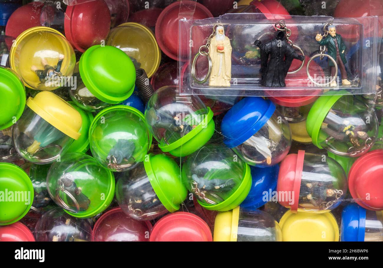 A view of colorful toys with key chains in capsules for vending ...