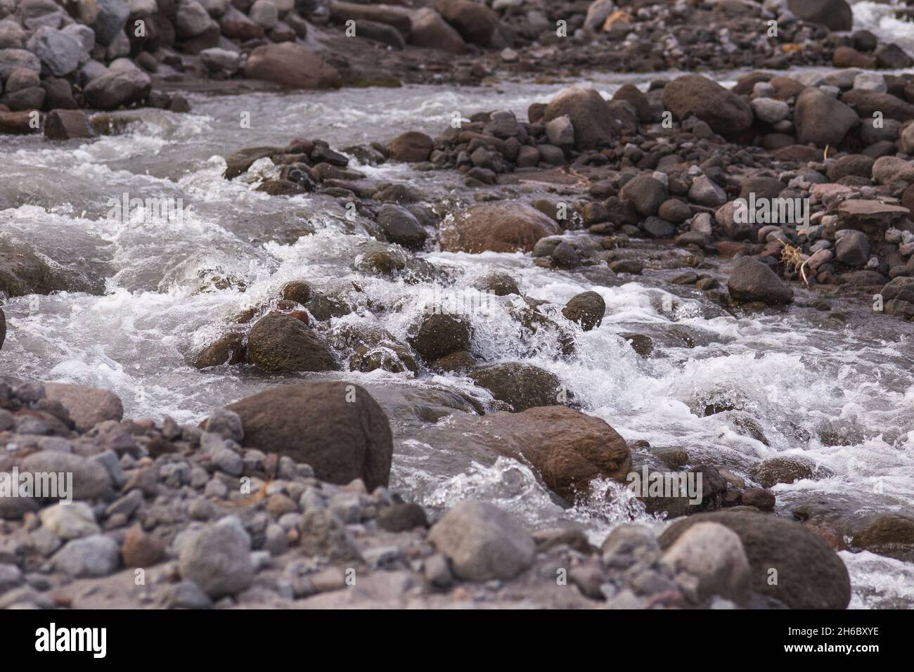 Water rolling over rocks hi-res stock photography and images - Alamy