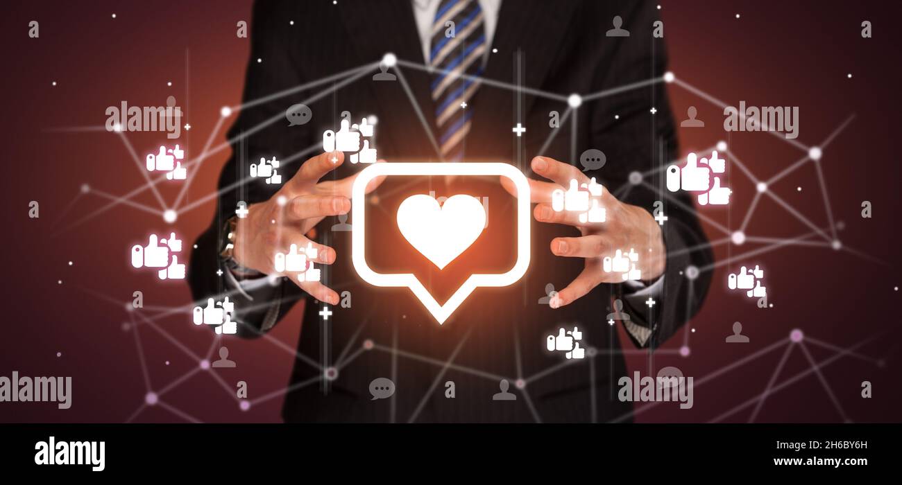 Hand holding social media icons Stock Photo - Alamy