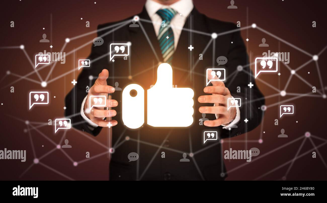 Hand holding social media icons Stock Photo - Alamy