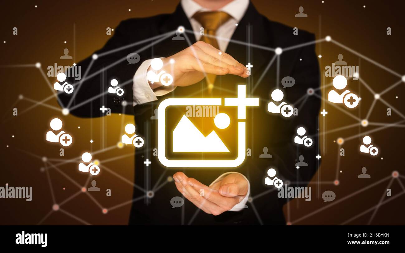 Hand holding social media icons Stock Photo - Alamy