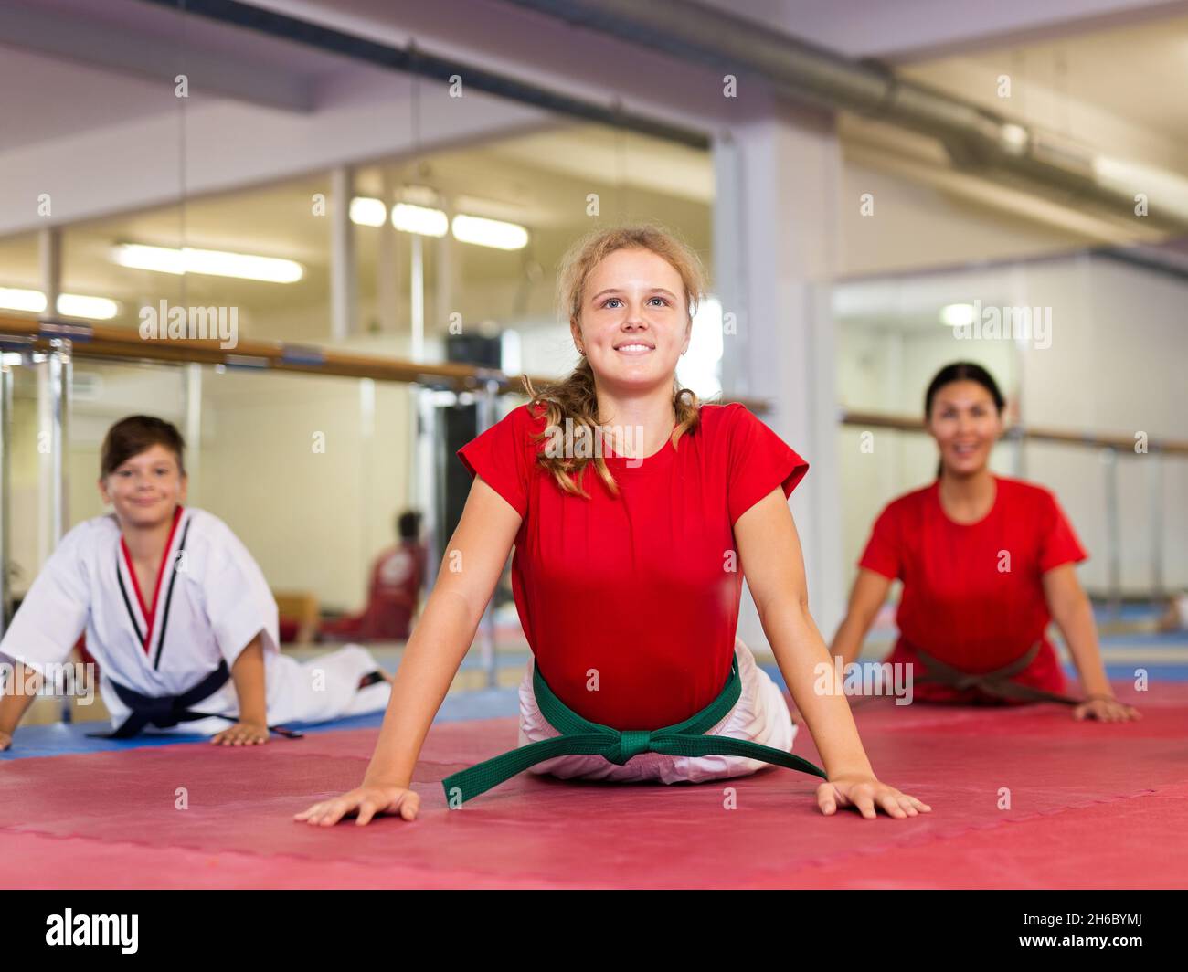 Preteen girl doing push-ups Stock Photo - Alamy