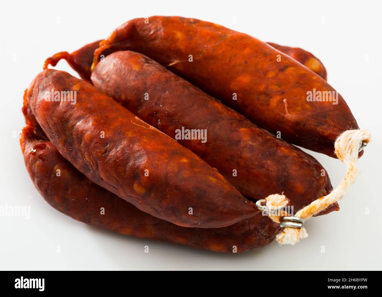 Sausages chorizo on white surface Stock Photo - Alamy