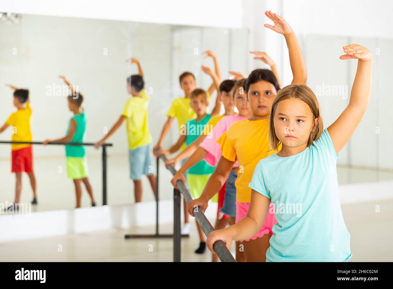 Children exercising ballet moves in studio Stock Photo - Alamy
