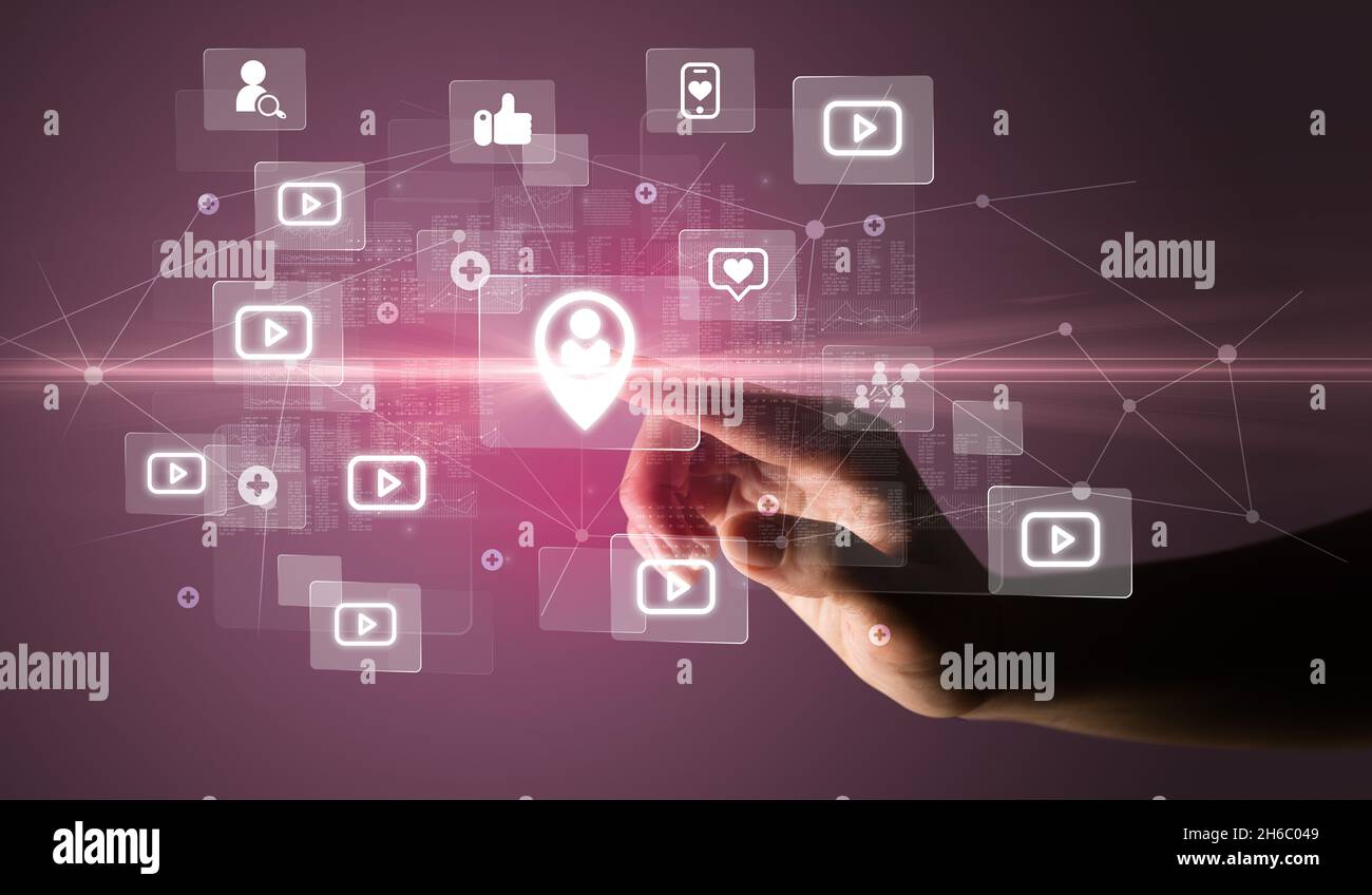 Hand pressing social media multimedia application screen with media ...