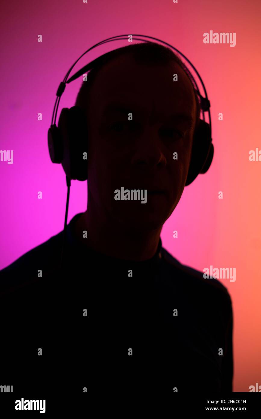 Dj deejay electronic wearing music headphones with coloured lights ...