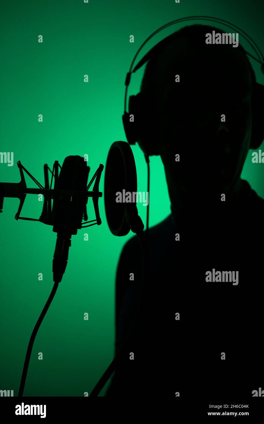 Voice over artist in booth hi-res stock photography and images - Alamy