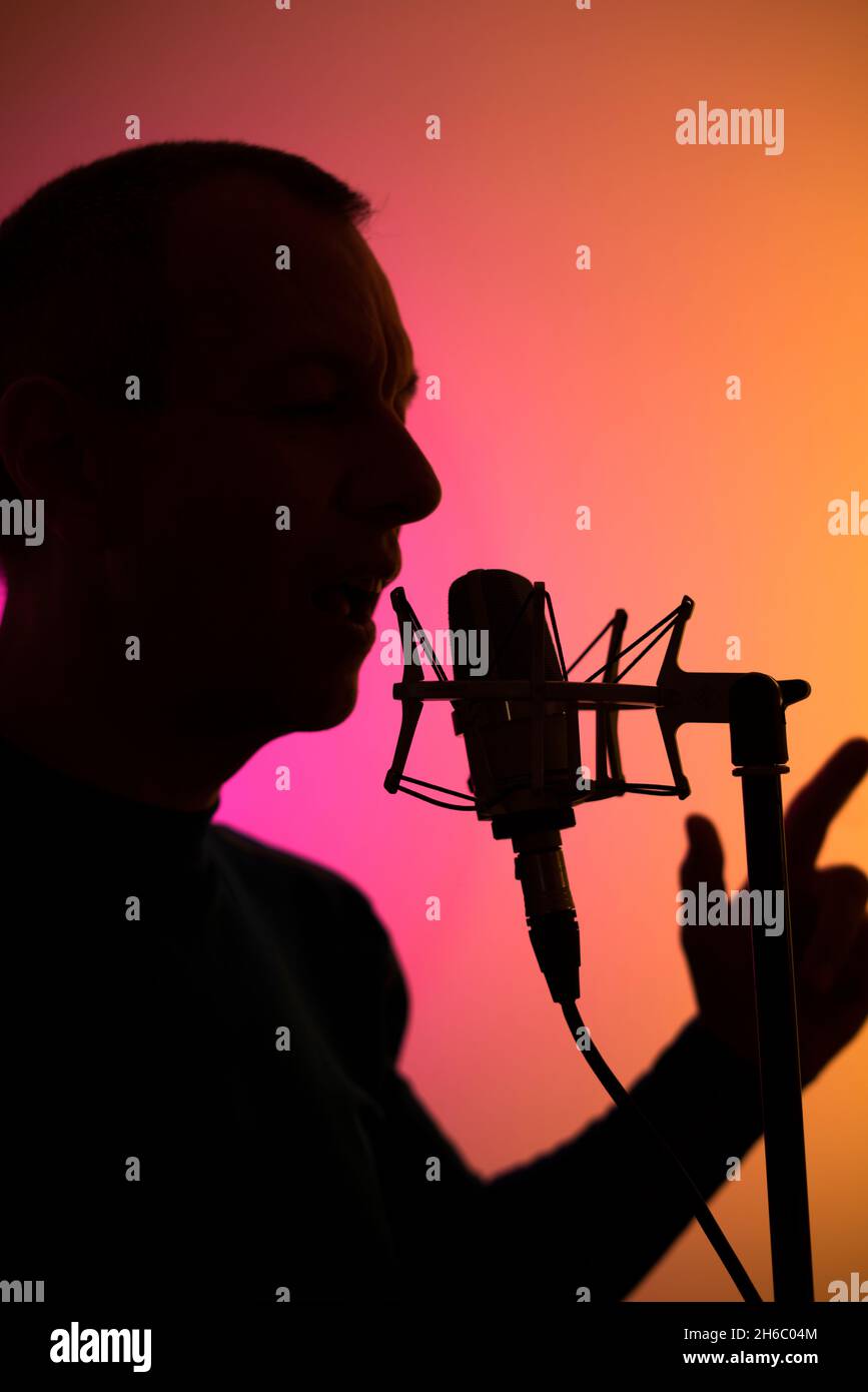 Voice over artist in booth hi-res stock photography and images - Alamy