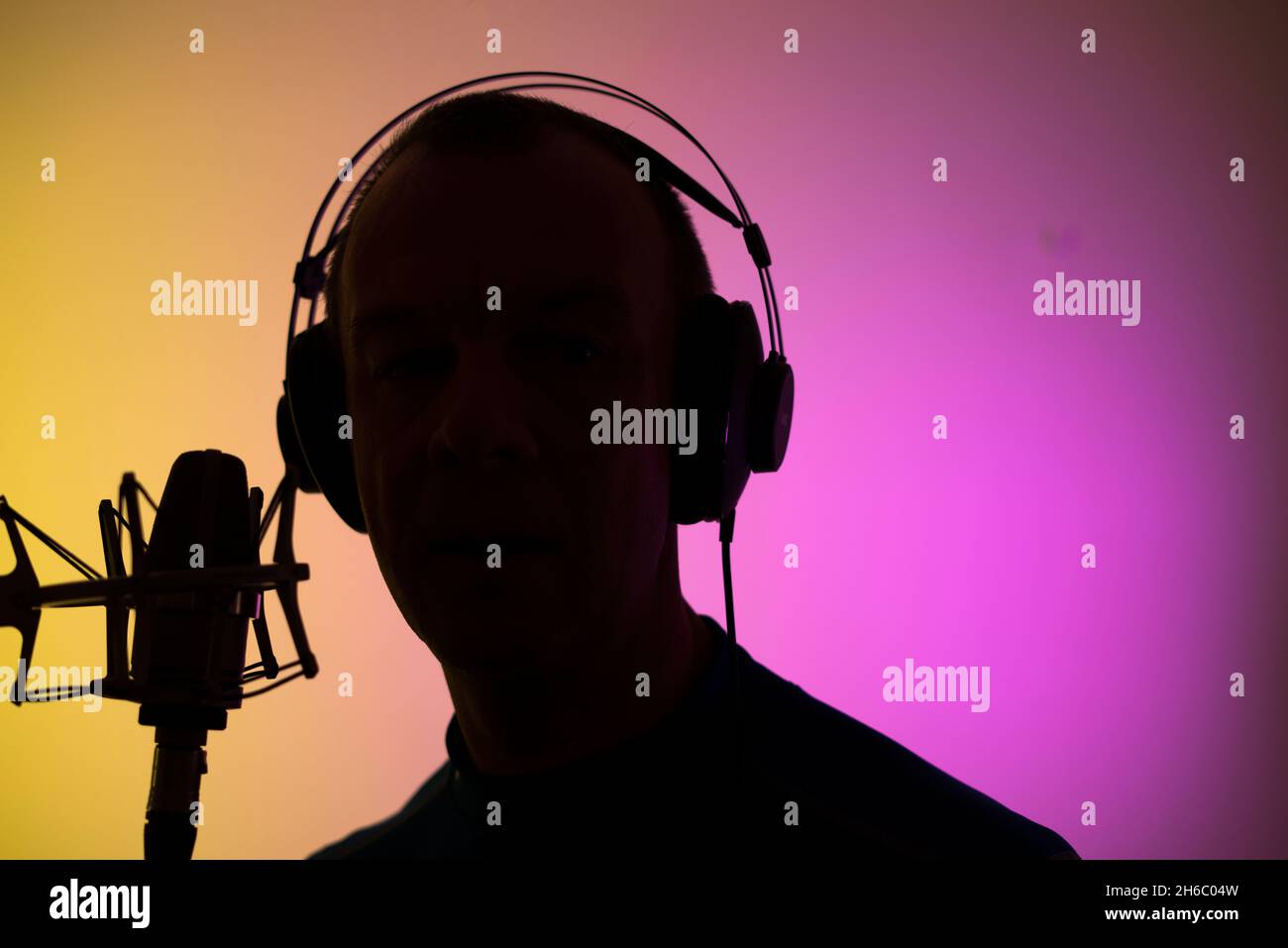 Voice over artist in booth hi-res stock photography and images - Alamy