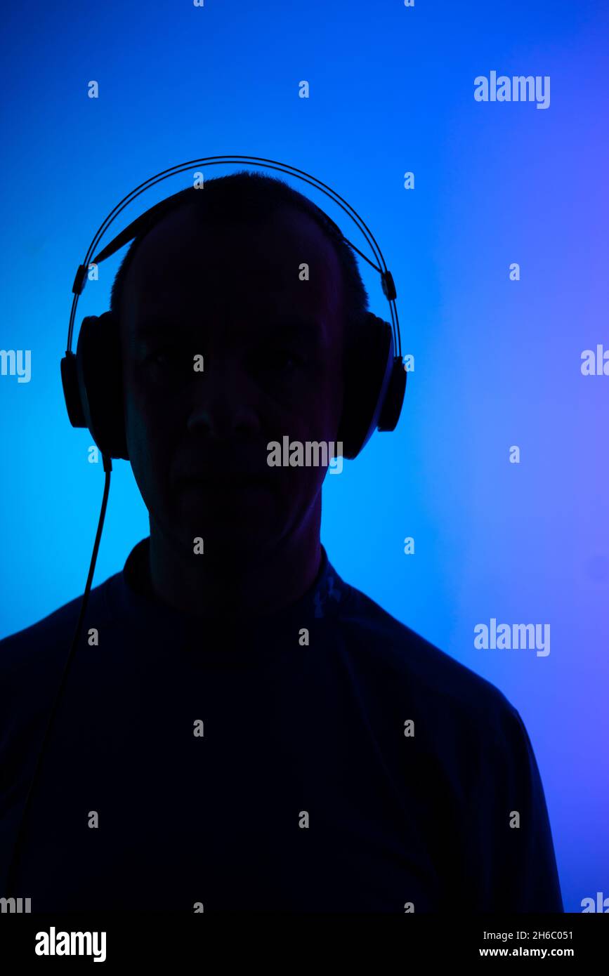 Dj deejay electronic wearing music headphones with coloured lights ...