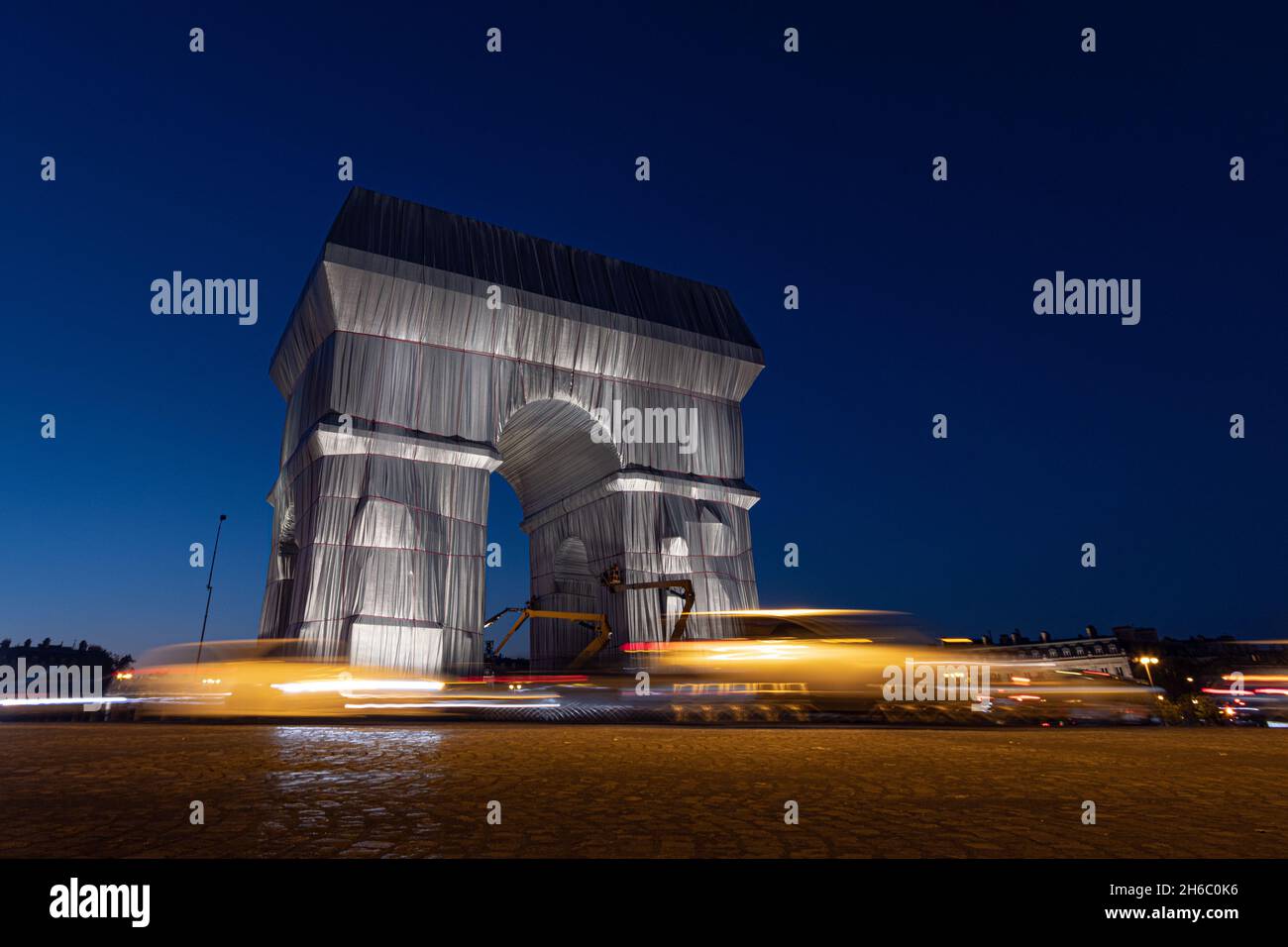 A Long Exposure Shot Of Cars Passing By The Arch Of Triumph Of Paris At