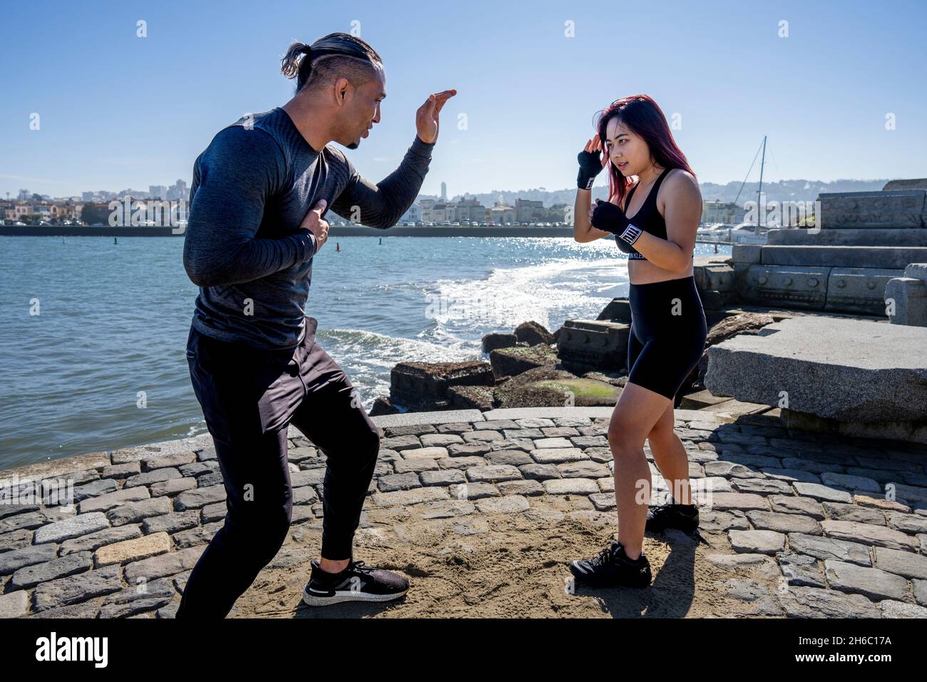 Young Asian Woman Taking First MMA Training Session with Personal ...