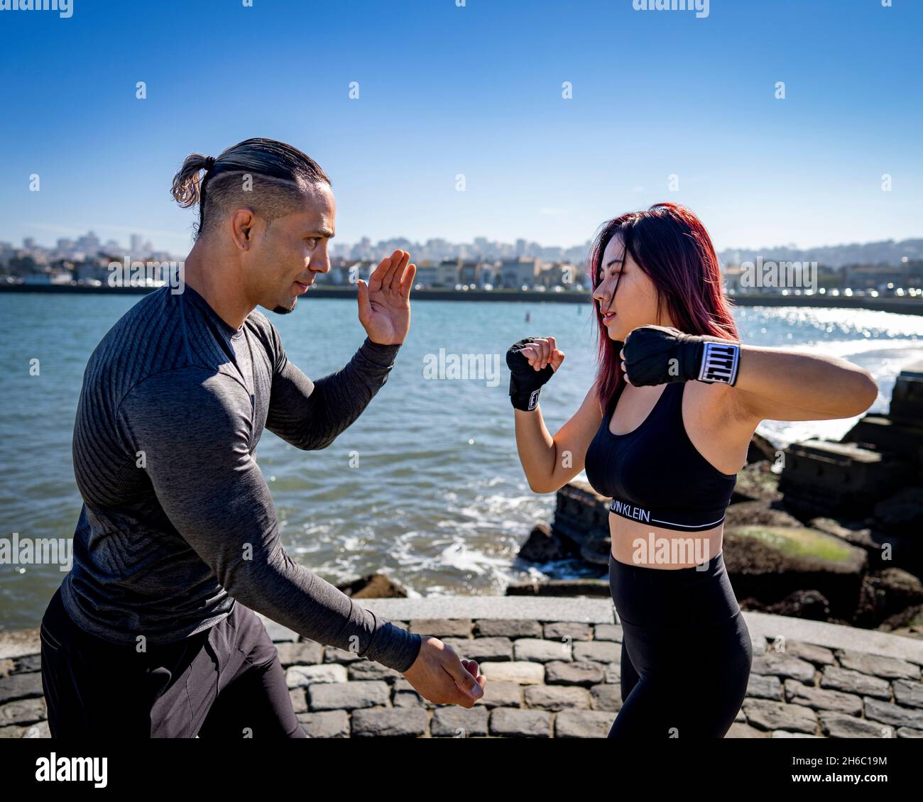 Young Asian Woman Taking First MMA Training Session with Personal ...