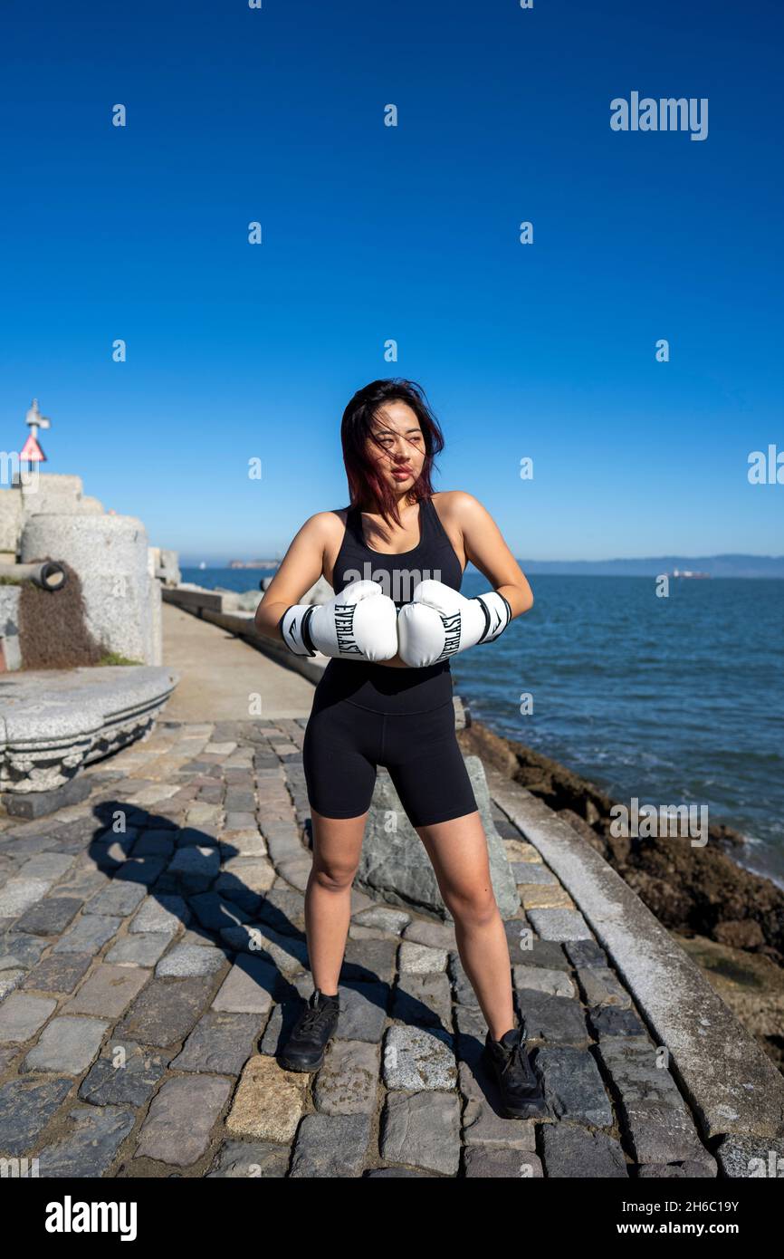 Young Asian Woman Taking First MMA Training Session with Personal ...