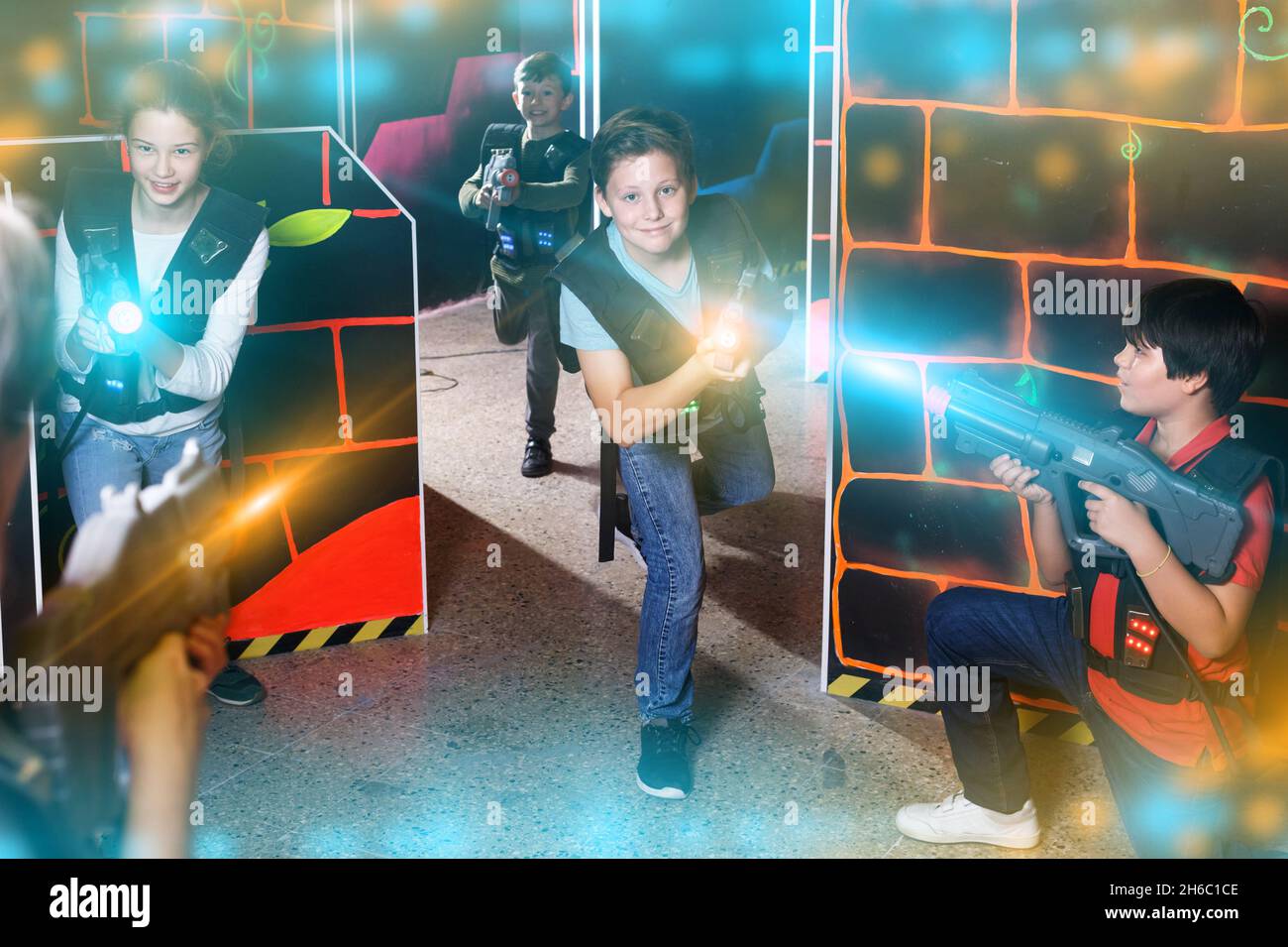 Kids playing laser tag on labyrinth Stock Photo - Alamy