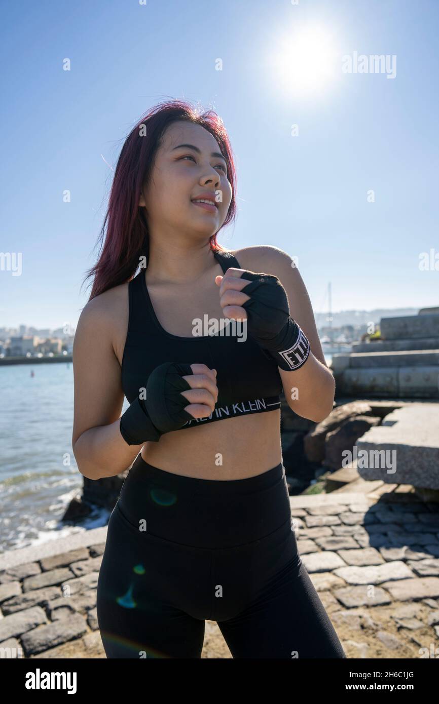Young Asian Woman Taking First MMA Training Session with Personal ...