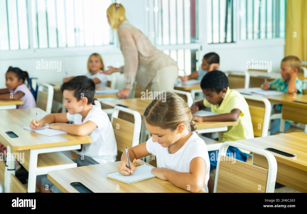 Group of focused kids working at class Stock Photo - Alamy
