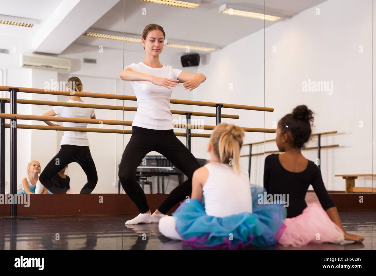 Dance teacher showing correct ballet position Stock Photo - Alamy