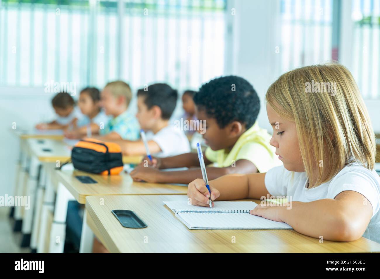 Side view of group of elementary school students Stock Photo - Alamy