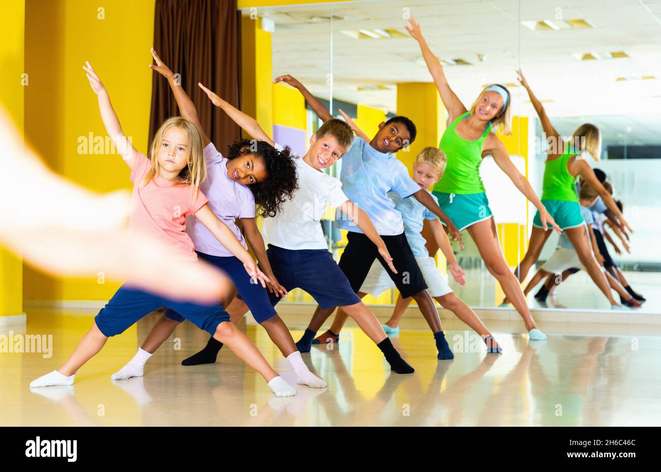 Preteen dancers practicing dance routine with female choreograph Stock ...