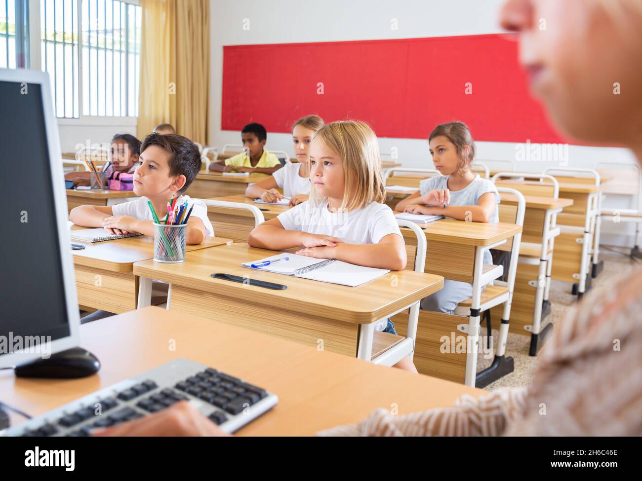 Group of focused children working at class Stock Photo - Alamy