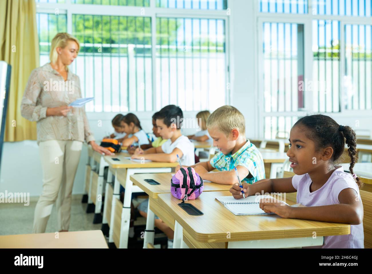 Side view of group of elementary school students Stock Photo - Alamy