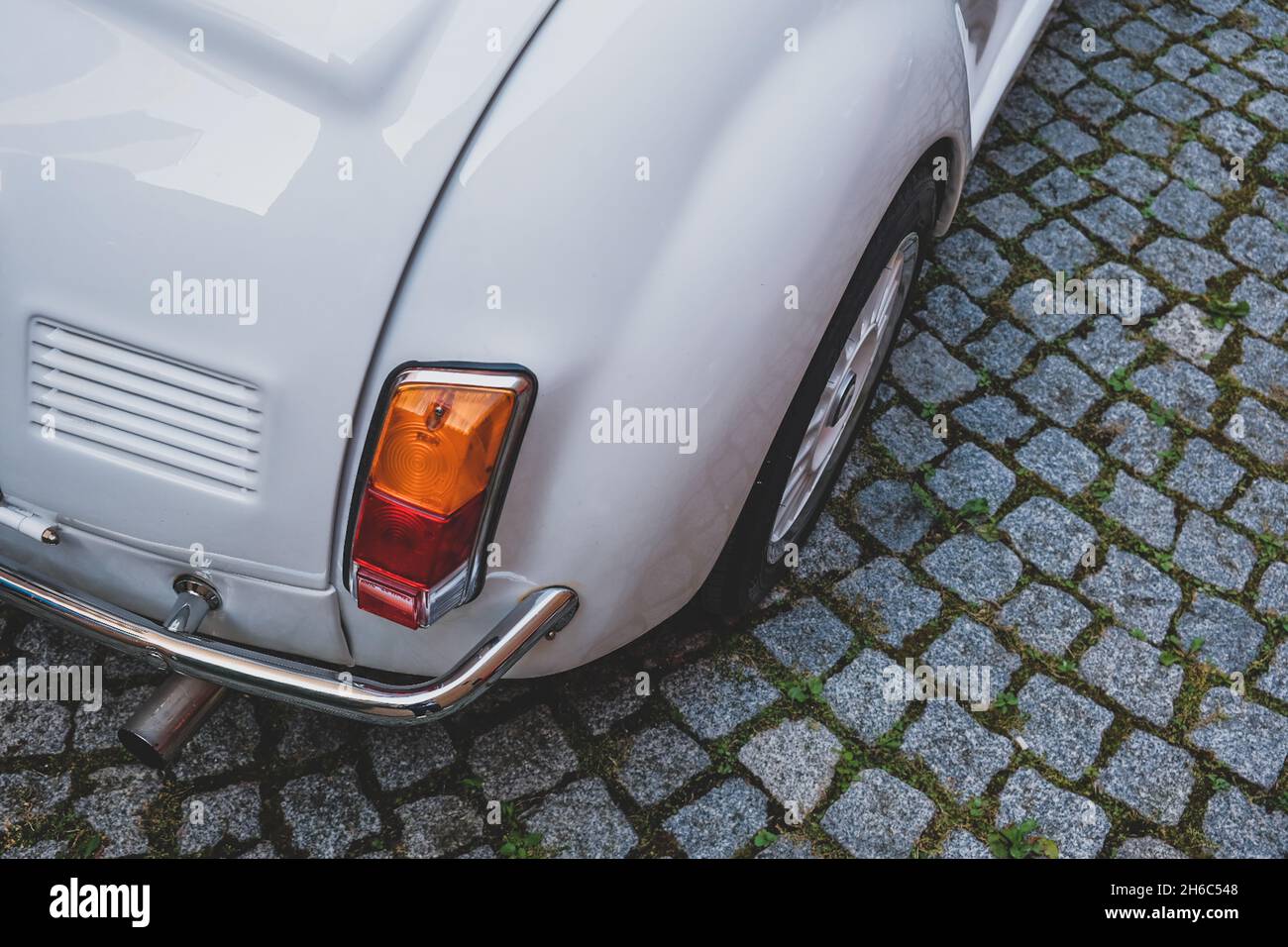 High angle shot of a white oldtimer cabrio car backlight Stock Photo ...