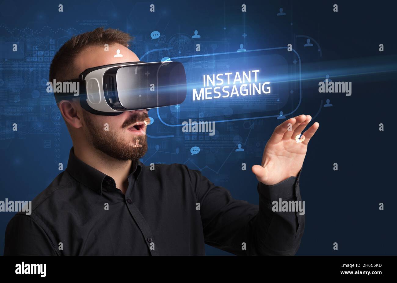 Businessman looking through Virtual Reality glasses, social media ...