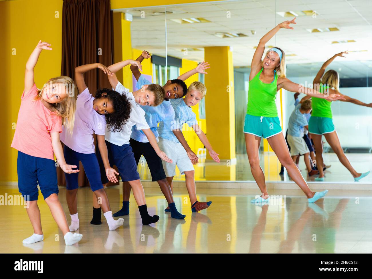 Preteen dancers practicing dance routine with female choreograph Stock ...