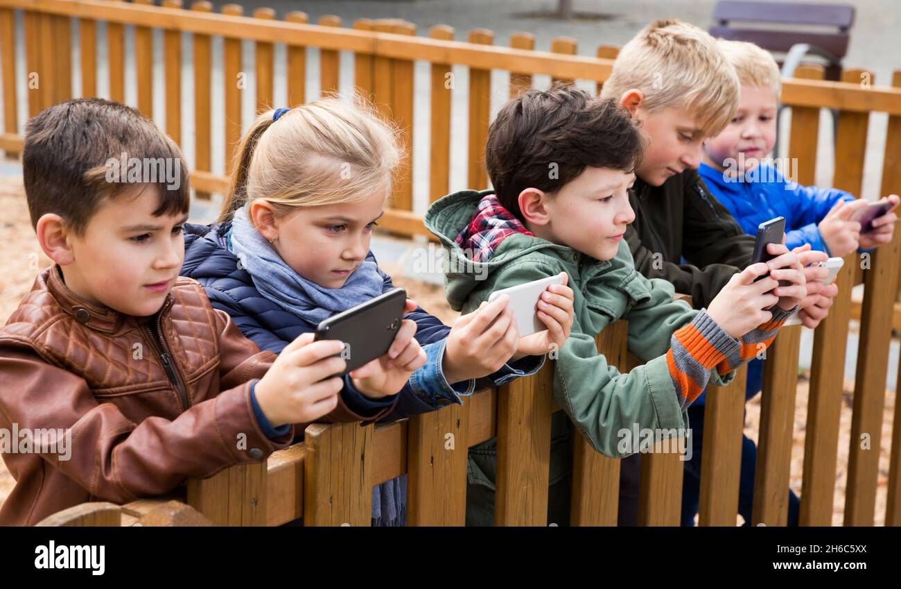 Kids with phone Stock Photo - Alamy