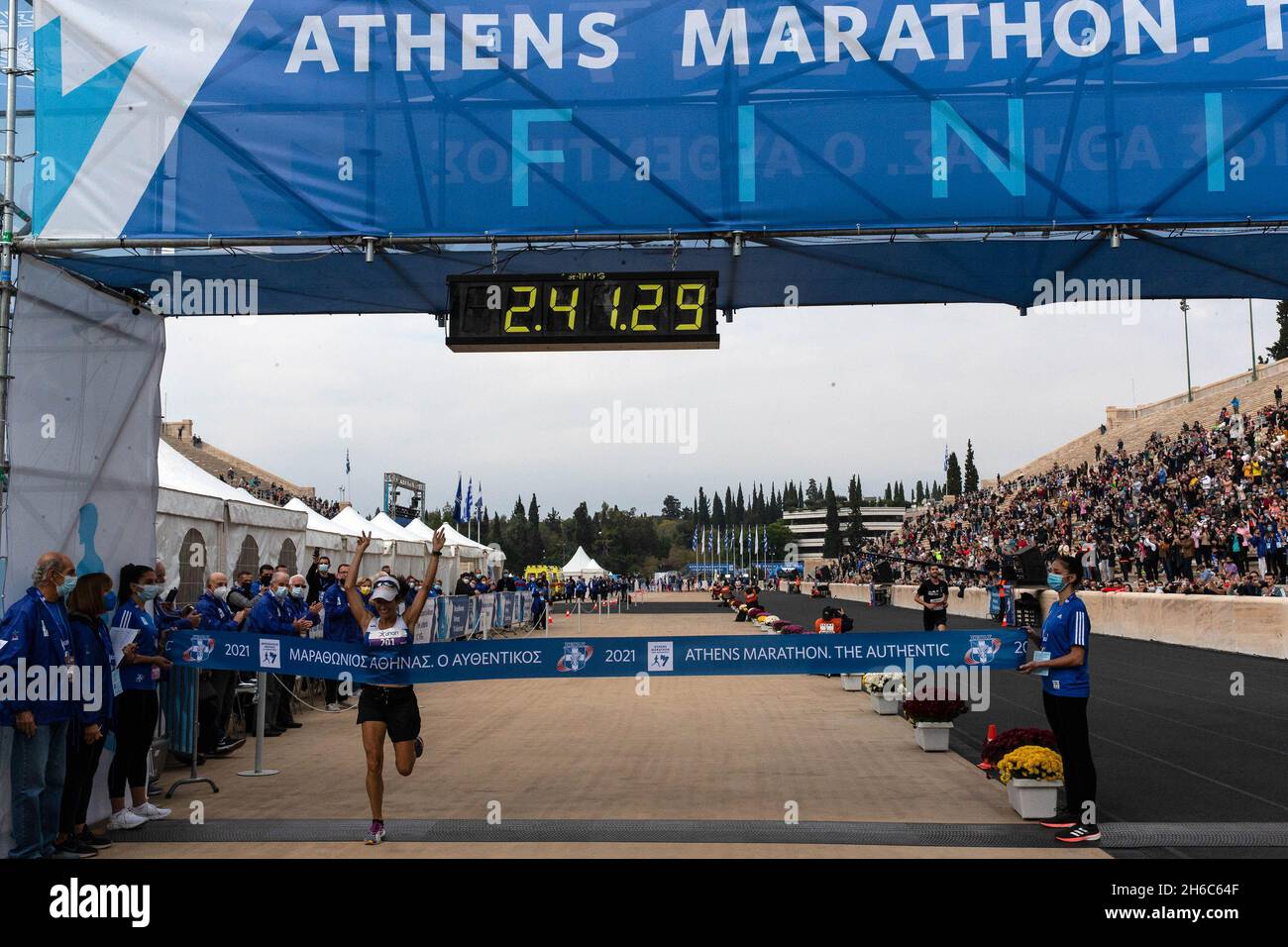 Runner crosses finish line in hi-res stock photography and images - Alamy