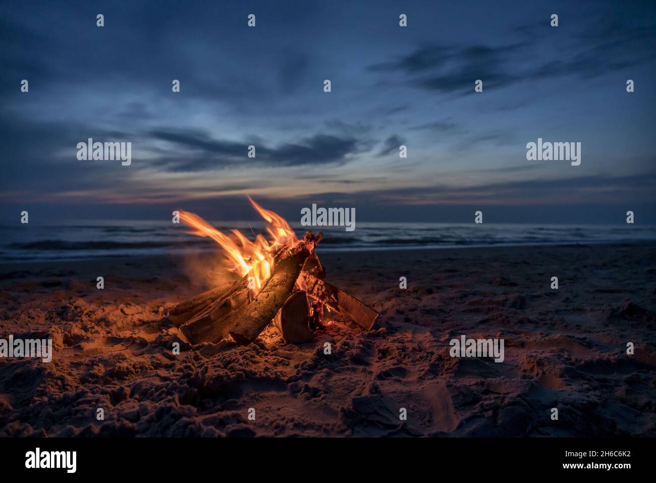 Campfire on the sandy beach at night. Tversted, Denmark Stock Photo - Alamy