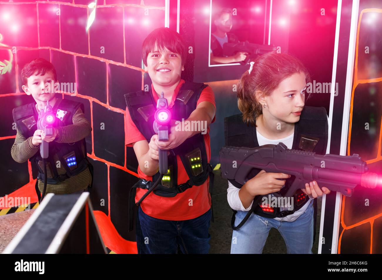 Kids playing laser tag on labyrinth Stock Photo - Alamy