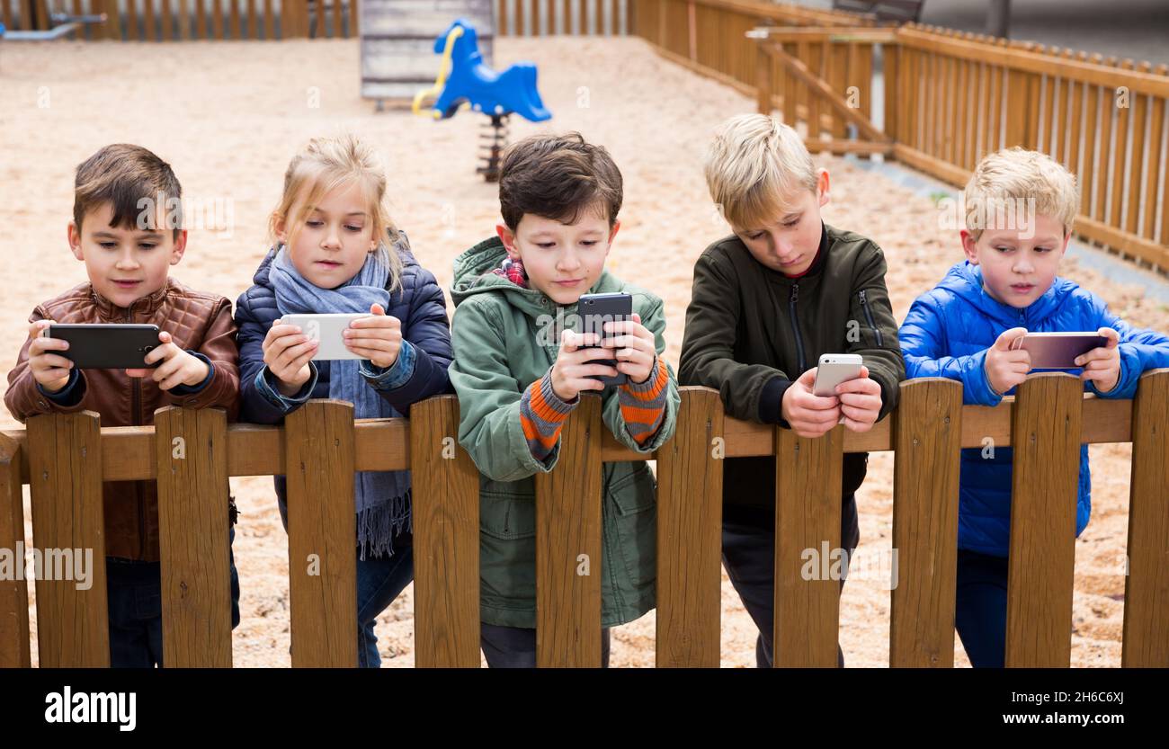 Kids with phone Stock Photo - Alamy