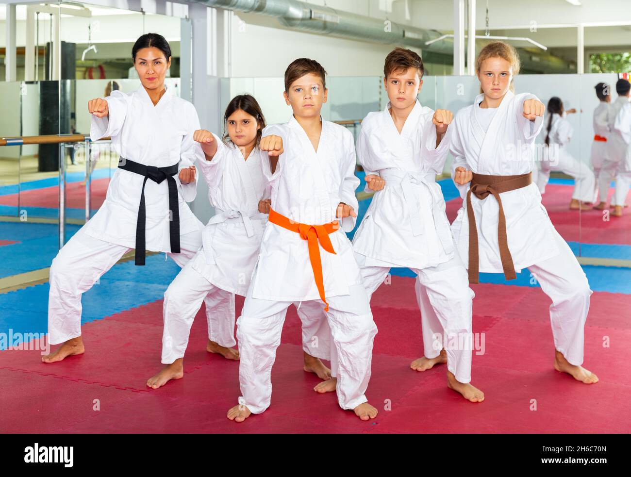 Kids in karate uniform performing kata Stock Photo - Alamy