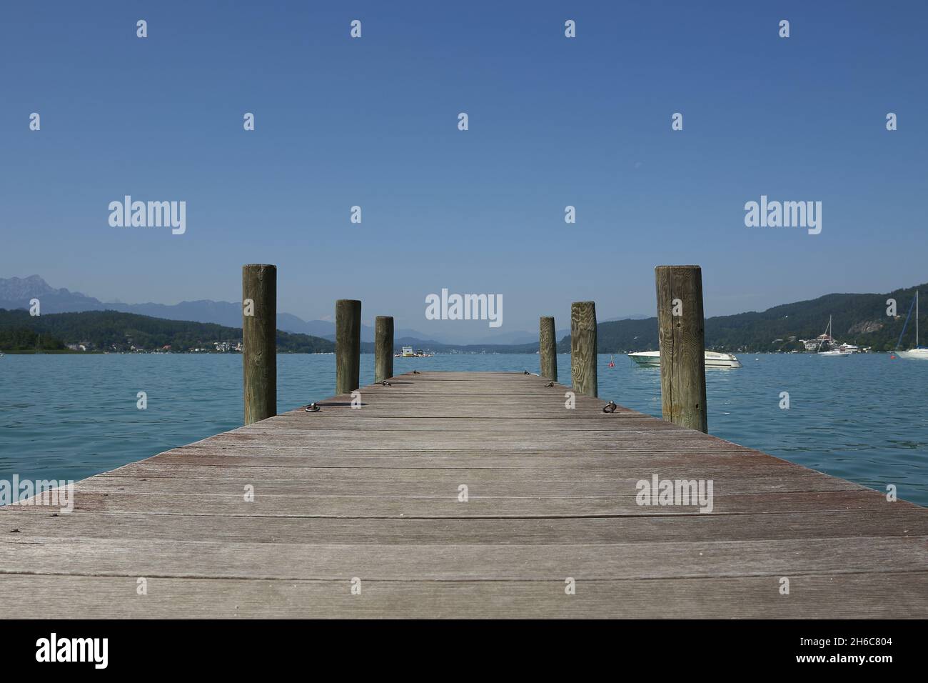 Wooden pier facing the blue horizon Stock Photo - Alamy